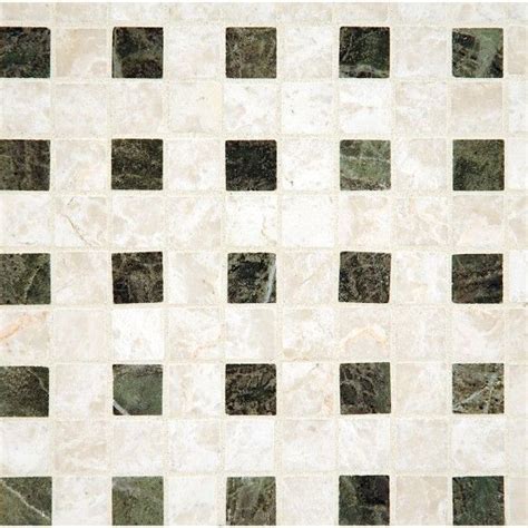 A White And Black Checkered Tile Pattern With Green Squares On The