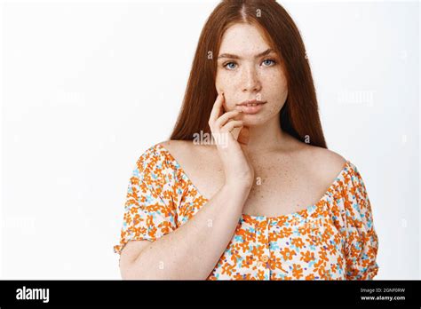 Women Beauty And Skin Care Young Timid Girl With Red Hair Touching