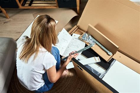 Premium Photo Woman Reading Manual Instruction To Assemble Furniture