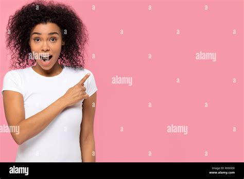 Amazed African Woman Pointing Finger At Copyspace Surprised By Sale