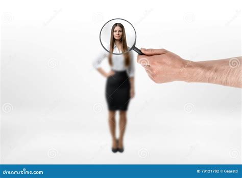 Businesswoman Unfocused Body And Face Focused With Magnifying Glass