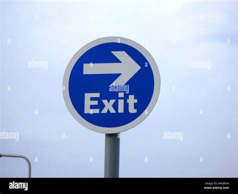 A Blue Exit Sign Pointing Right Stock Photo Alamy