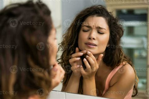 Beautiful Woman Squeezing Pimple In The Bathroom 34824428 Stock Photo At Vecteezy