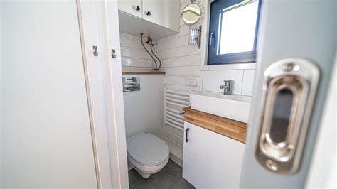 Snowdrop Tiny House Is Cozy Bright Home With Twin Lofts