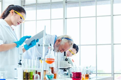 Premium Photo Scientists Performing Experiment While Working In