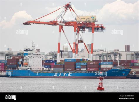 A Shipping Crane Loads A Container Ship At Tokyo Bay Japan Is Heavily Reliant On Exports E G