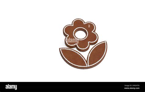 3d Rendering Of Gingerbread Cookie In Shape Of Symbol Of Flower With Leaves Isolated On White