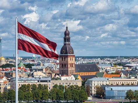 Premium Photo Panorama Of Riga City With A Big Latvian Flag In Foreground