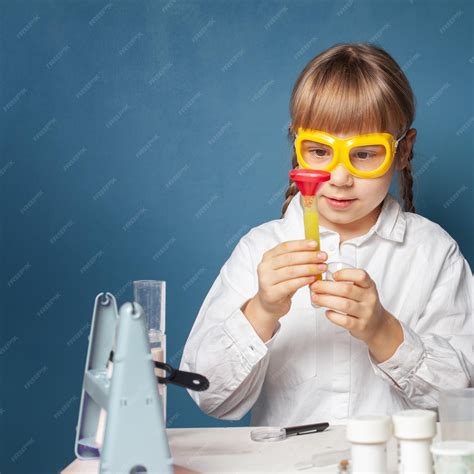 Premium Photo Smiling Girl Doing A Science Experiment For School
