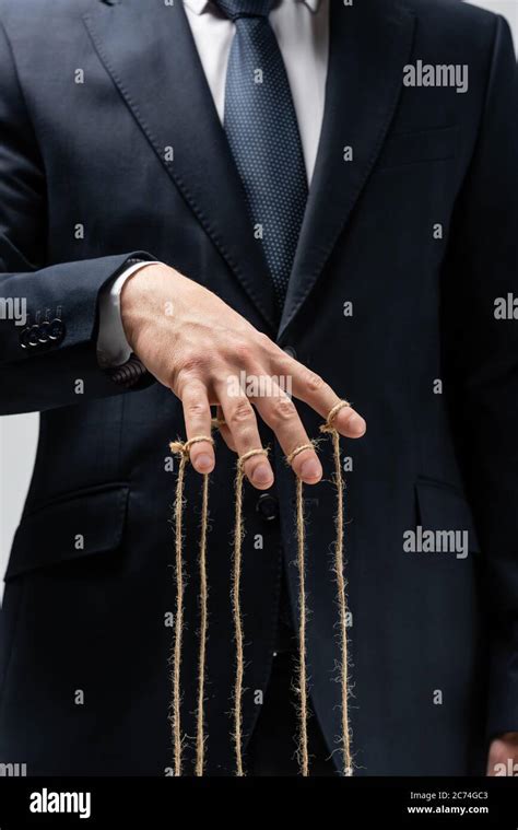 Partial View Of Puppeteer In Suit With Strings On Fingers Stock Photo Alamy