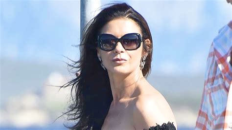 Catherine Zeta Jones Slays Plunging Swimsuit In Sexy Seflies