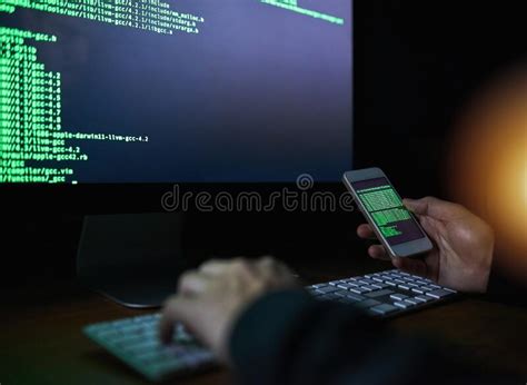 No Code Is Uncrackable An Unidentifiable Computer Hacker Using A Smartphone To Hack Into A