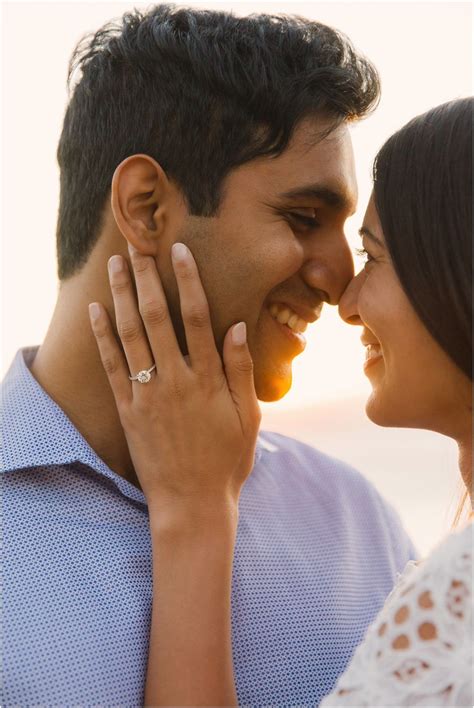 Engagement Ring Couple Showing Off Engagement Ring Photo Poses For