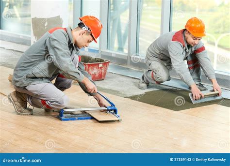 Two Tilers At Industrial Floor Tiling Renovation Stock Image Image Of Ceramic Cutter 27359143