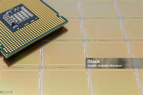 Computer Cpu Processor Chip On Yellow Surface Of Slicion Wafer Chip