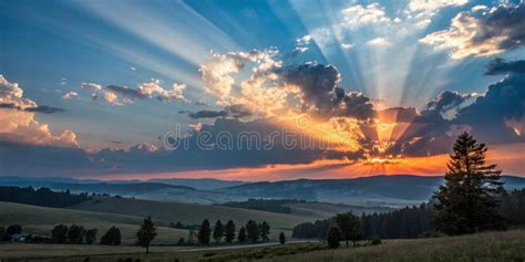 Dramatic Sunrise With Orange Sun Rays Breaking Through Clouds Stock
