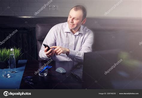 Man At Table And Working On Laptop Stock Photo Alexkich 326748230