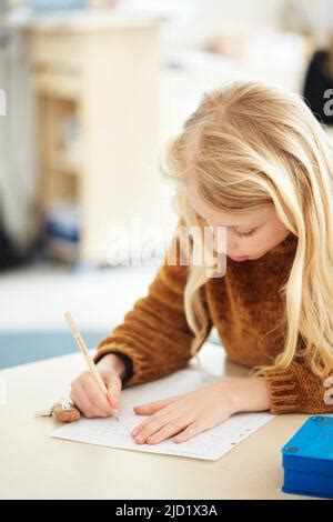 Girl Doing Writing Assignment At School Stock Photo Alamy