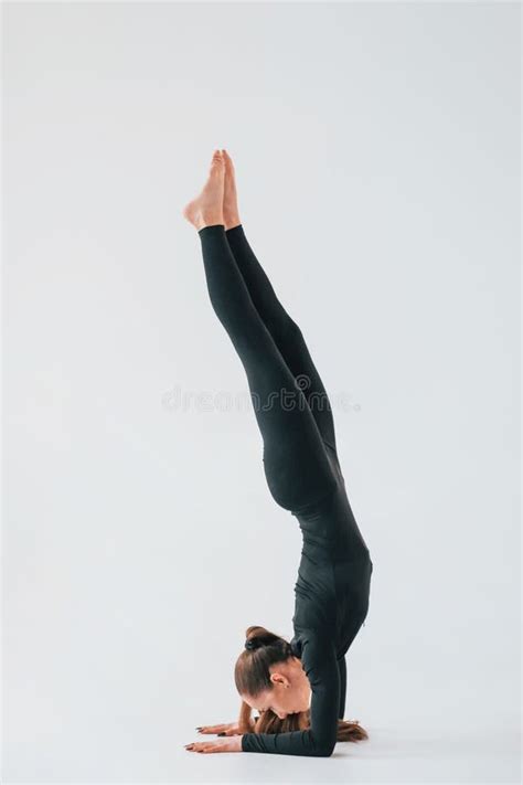 Practice Routine Young Woman In Sportive Clothes Doing Gymnastics