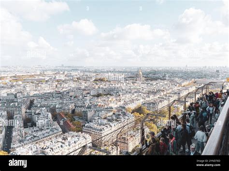 Tourists On The Observation Deck At The Top Of The Eiffel Tower Paris