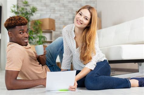 Two Student Working On Lesson Siting On Floor Stock Photo Image Of Reading Data