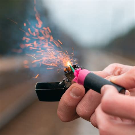 Premium Photo Setting Firecracker On Fire