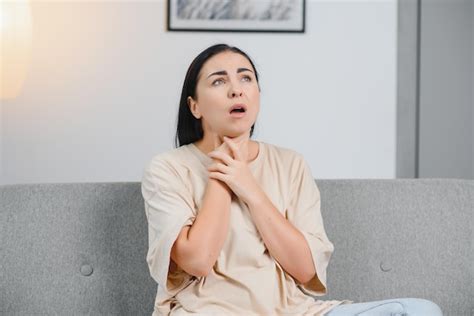 Premium Photo Attractive Brunette Sitting On Bed With Sore Throat