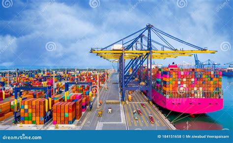 Business Logistics Import Export Container Cargo Ship In Seaport Terminal With Blue Sky