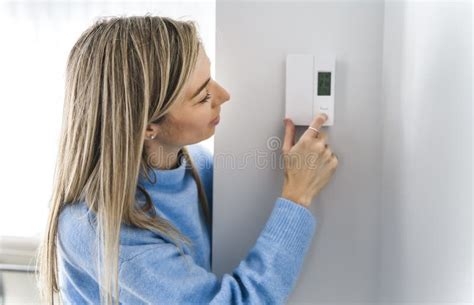 Woman Set The Thermostat At Home House Stock Photo Image Of Cold Conservation 320212042