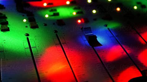 dj adjusting volume by stocksy contributor harald walker stocksy