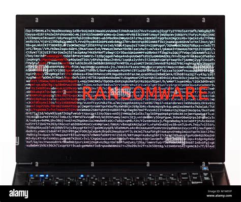 ransomware text with red lock over encrypted text on a laptop screen