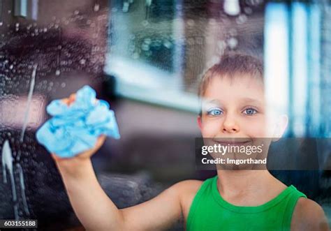Boy Cleaning Window Photos And Premium High Res Pictures Getty Images