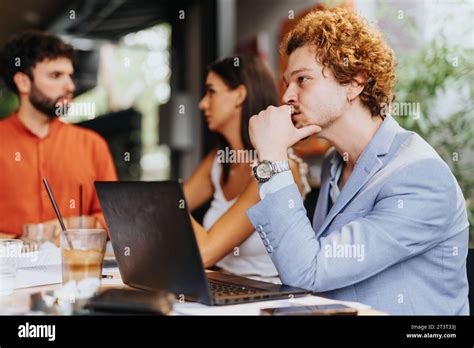 A Collaborative Team Of Architects Designers And Engineers Strategize Sustainable Project