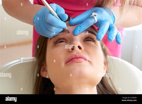 Professional Eyebrow Correction In Beauty Salon Stock Photo Alamy