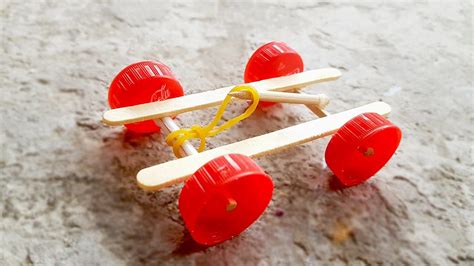 Como Fazer Um Carrinho Simples Movido A Elástico Youtube