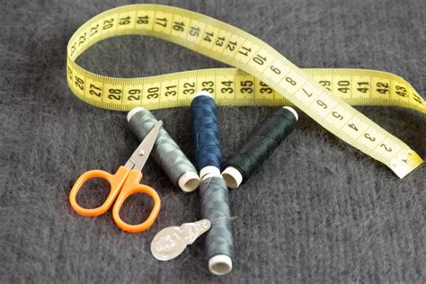 Premium Photo Close Up Of Thread Spool And Tape On Table