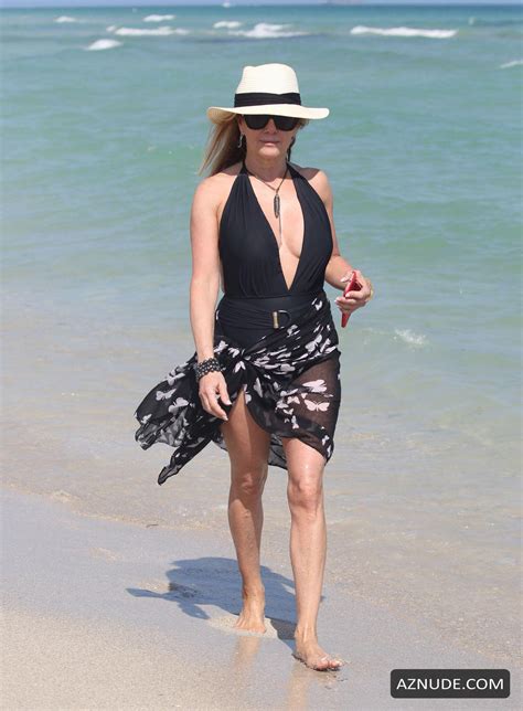 Ramona Singer Sexy In Low Cut Black Swimsuit As She Takes A Walk On The Beach In Miami Aznude