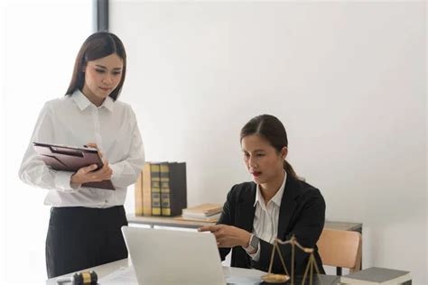 Legal And Justice Concept Two Female Lawyers Discussing About Contract And Agreement Of