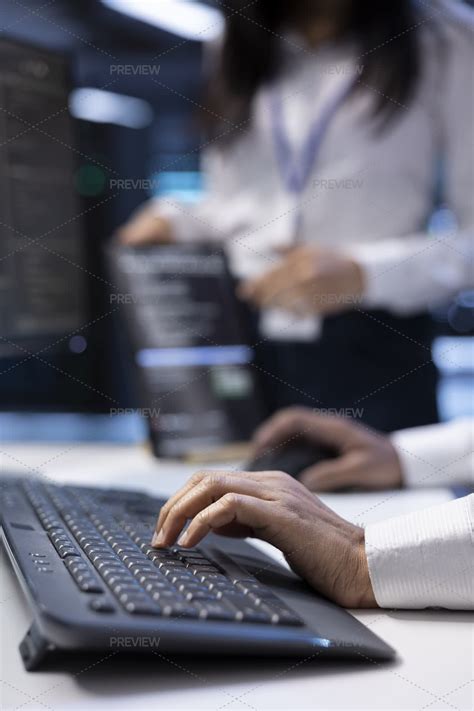 Electrician Using Pc To Review Blade Servers Configuration Settings