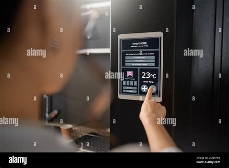 Smart Home IOT Wall System And Woman With Digital App Monitor For Thermostat Heating