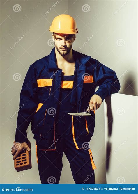 Handsome man builder stock image. Image of tool, construction - 137874533