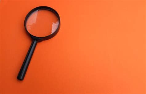 Premium Photo Copy Space Black Magnifying Glass On Orange Background