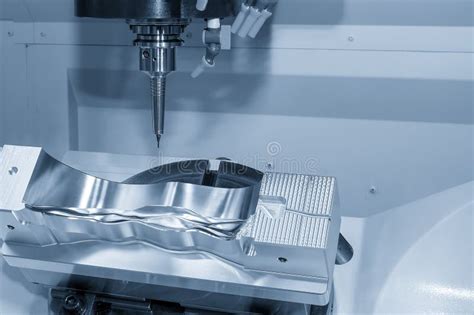 The 5 Axis Cnc Milling Machine Cutting Mold Part By Solid Ball Nose End Mill Tool In The Light
