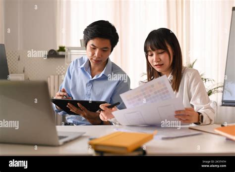 Team Of Web Designers Collaborating And Developing Template Layout For