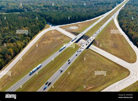 Aerial View Of Freeway Overpass Junction With Fast Moving Traffic Cars