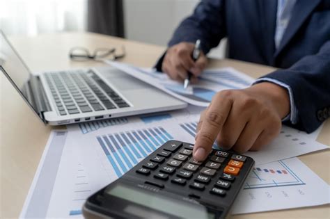 Premium Photo Midsection Of Person Using Calculating Chart With