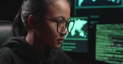 Asian Young Girl Hacker Hacking With Multiple Computer Screens In Dark Room Stock Video