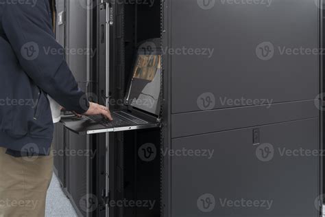 Close Up On Data Center Engineer Hands Using Keyboard On A