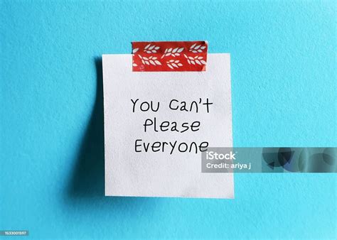 White Note Stick On Blue Background With Handwritten Text You Cant