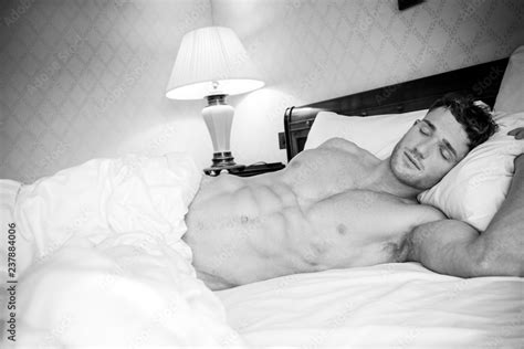 Handsome Hunky Muscular Man With Six Pack Abs Sleeping In Between White